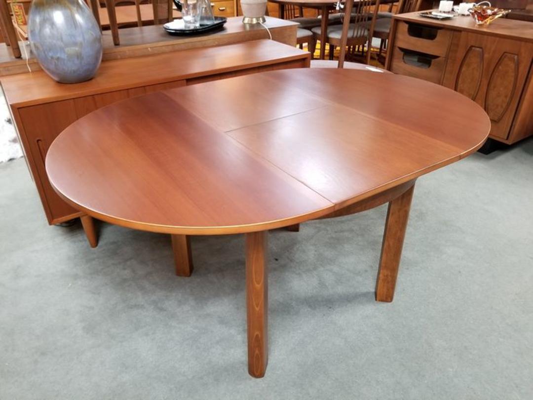 Mid-Century Modern round makore wood dining table with butterfly leaf ...