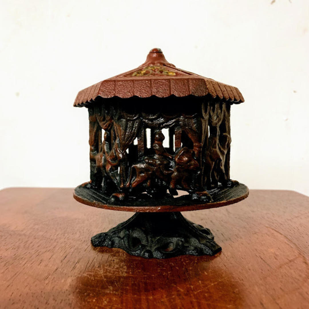 Vintage Cast Iron Black and Red Carousel Bank | Over the Years | Silver ...